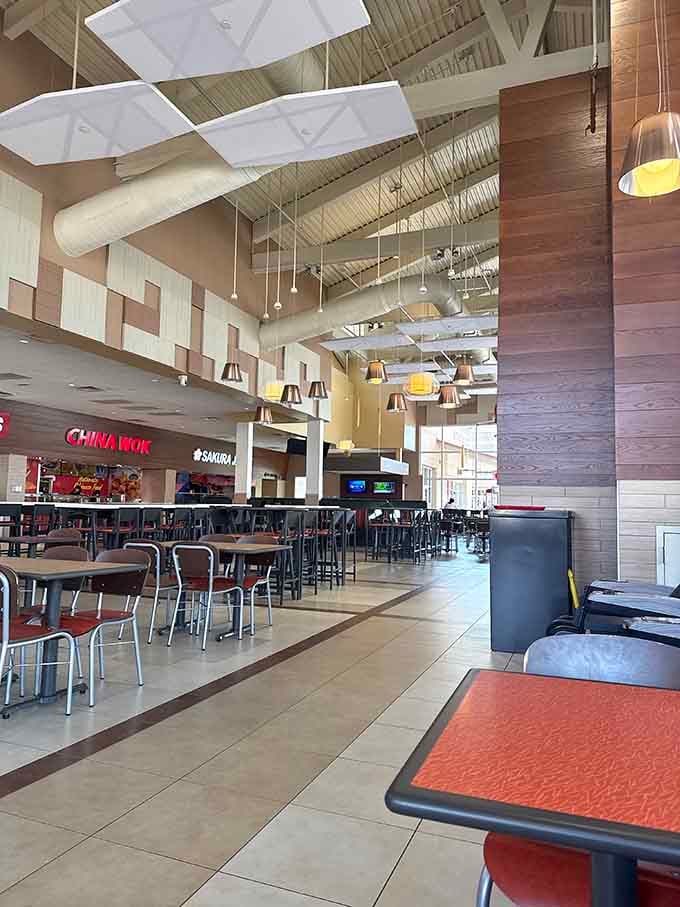 Modern food court design with high ceilings and natural light transforms refueling into a pleasant experience.