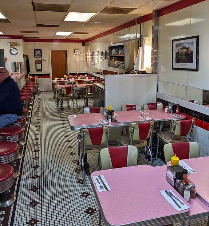 Pink tabletops and swivel stools invite you to linger longer, because good food deserves your full attention.