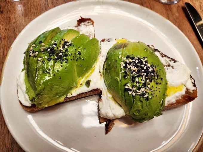 Avocado toast elevated with sesame seeds and olive oil, proving brunch classics belong in beautiful historic settings too.