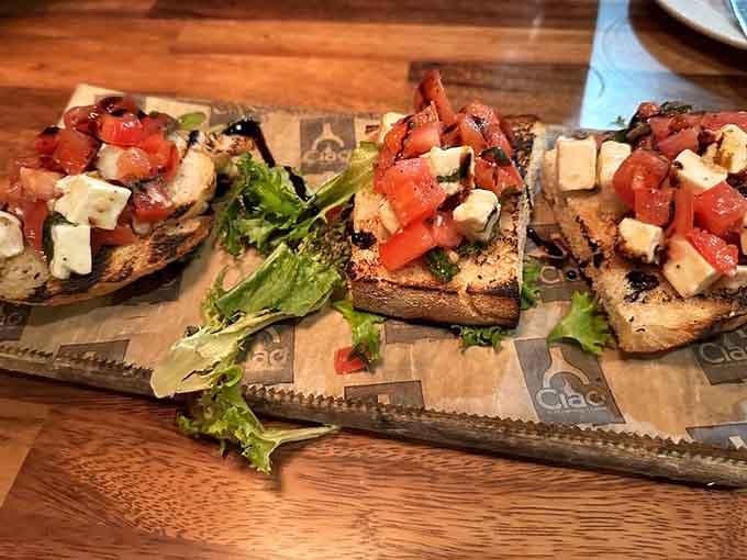 Bruschetta done right with fresh tomatoes and mozzarella, the kind of appetizer that makes you reconsider your entr&eacute;e order.