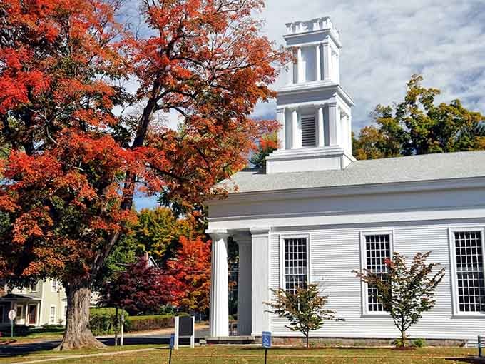 That white church steeple against autumn foliage is so perfectly New England, it could make a greeting card weep with envy.