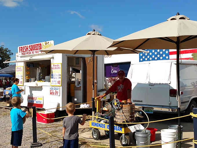Fresh-squeezed lemonade stand drawing a crowd, proving simple pleasures still win hearts and cool down hot Alabama shoppers.