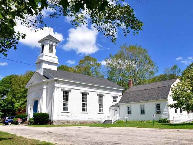 Classic New England meetinghouses still anchor their communities, white steeples visible for miles across the rolling countryside.