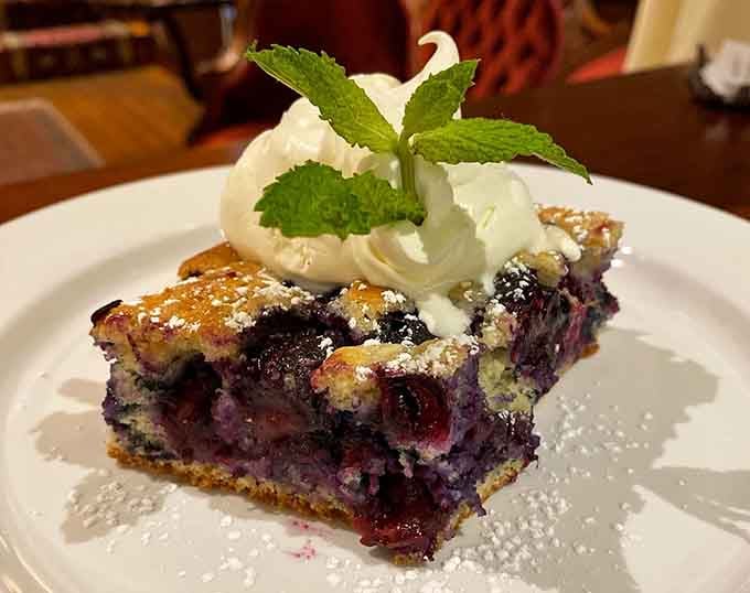 Blueberry pie topped with whipped cream and powdered sugar delivers the kind of dessert that makes diets seem irrelevant.