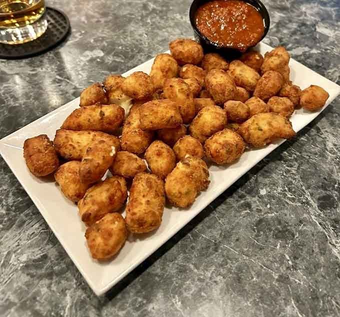 Golden cheese curds with marinara sauce prove Wisconsin doesn't have a monopoly on fried cheese excellence.