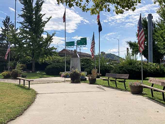 Flags wave proudly over benches that welcome weary travelers, offering rest stops that don't involve highway rest areas.
