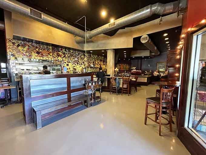 Exposed ductwork and warm lighting blend industrial chic with welcoming vibes that actually work together.