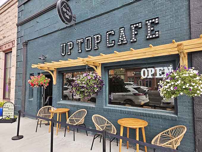 Up Top Cafe's turquoise brick and hanging flowers create the kind of corner spot every small town deserves.