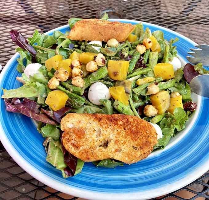 When a bakery serves salads this vibrant, you know they understand balance, even if you're ignoring it completely today.