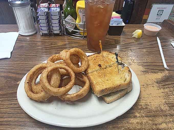 Golden onion rings and a grilled sandwich make for the kind of lunch worth celebrating.