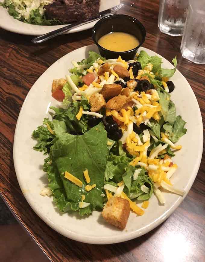 This salad comes loaded with enough toppings to make you forget you're technically eating something healthy.