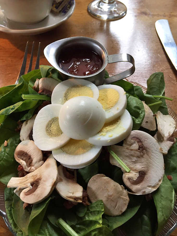Fresh spinach, sliced mushrooms, and perfectly cooked eggs create a salad that's both virtuous and utterly satisfying to eat.