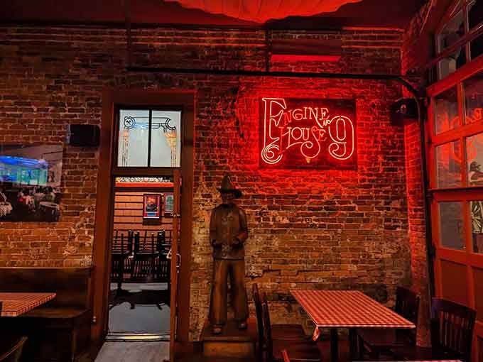 Red lighting against century-old brick creates an ambiance that modern restaurants spend fortunes trying to replicate unsuccessfully.