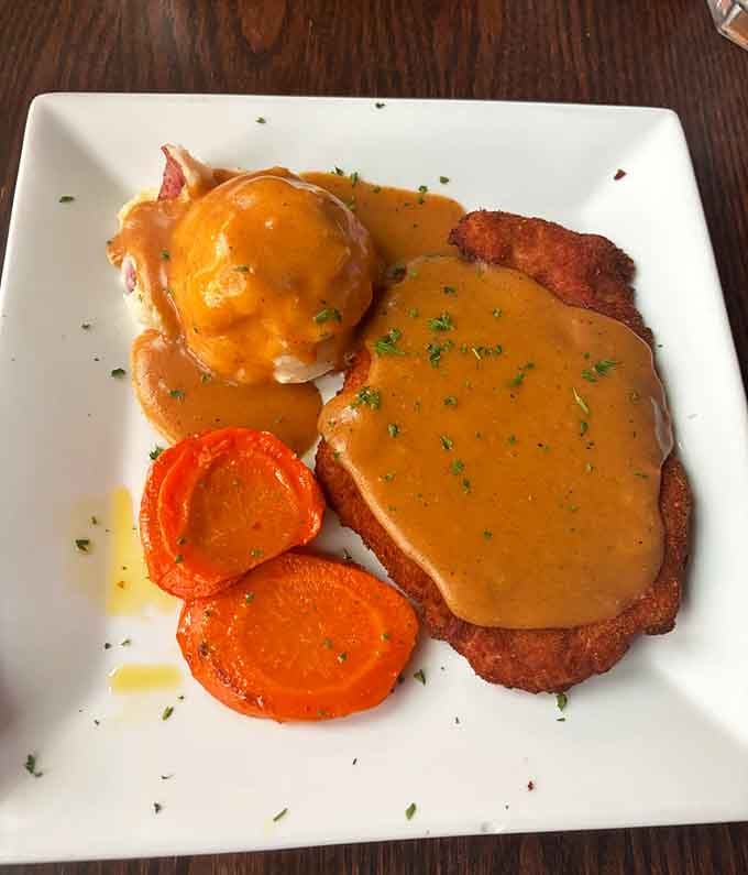 Paprika Schnitzel drowning in gravy with a side of sp&auml;tzle, this is comfort food that means serious business.