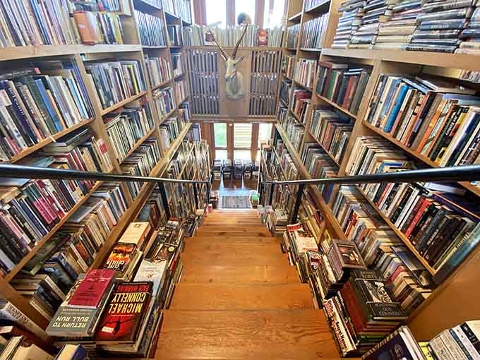 Looking down the stairwell reveals books lining every surface, like a bibliophile's fever dream come true.