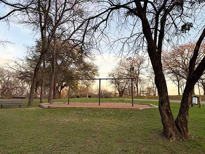 That vintage playground equipment hits different when it's surrounded by trees and the promise of s'mores later tonight.