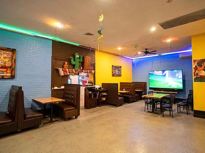 The bright yellow walls and cozy seating create an atmosphere that says "relax, you're among friends here now."
