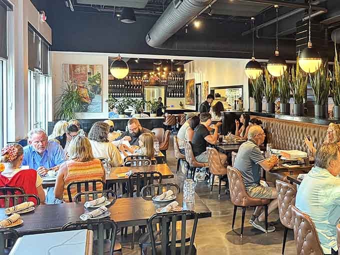 A full dining room is always a good sign, especially when everyone looks this happy and relaxed.