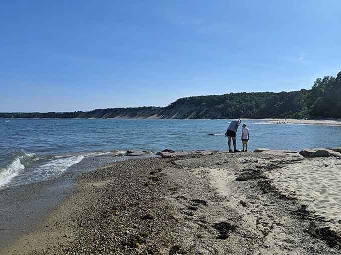 Two explorers stand at the water's edge, discovering why this cobblestone beach remains one of Plymouth's best-kept secrets.