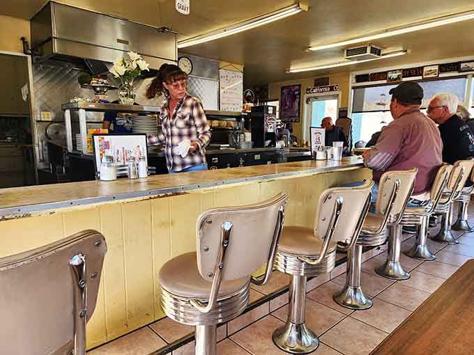 Counter seating where strangers become friends and everyone leaves happy, well-fed, and slightly nostalgic for simpler times.