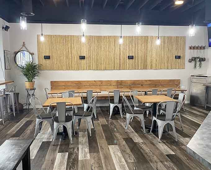 Another angle reveals the thoughtful design details, from the bamboo accent wall to the comfortable seating throughout the space.