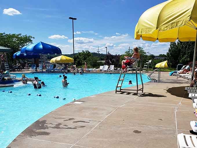 That lifeguard perched high has the best seat in the house, watching summer unfold one cannonball at a time.