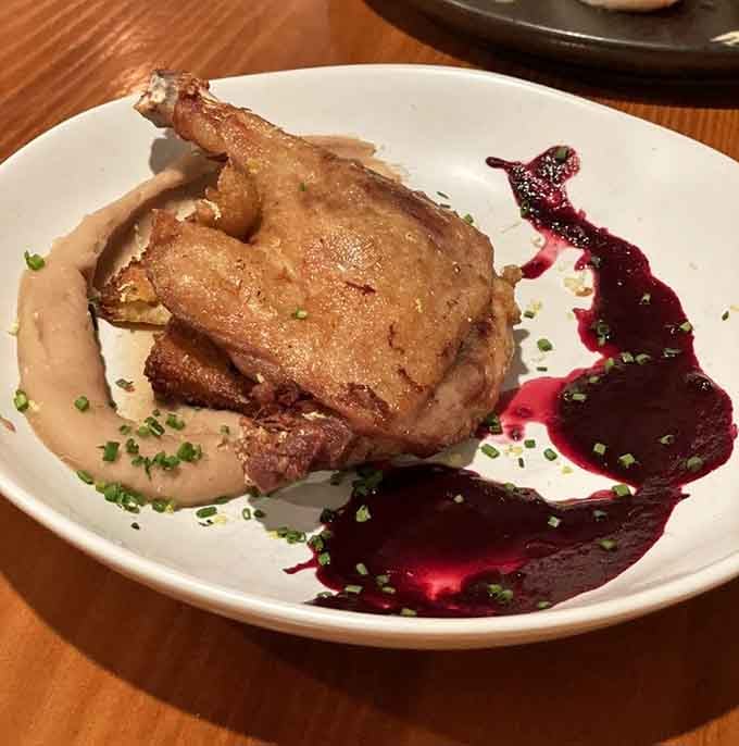 Duck confit so tender it practically falls apart before your fork even makes contact with the plate.