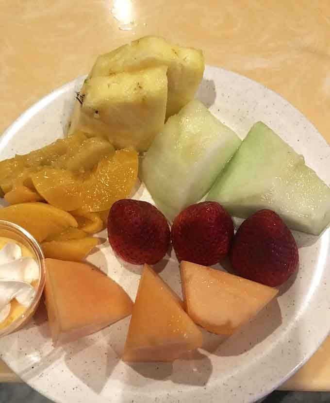 Fresh fruit cut with precision, offering nature's candy for those brief moments when you remember vitamins exist and matter.