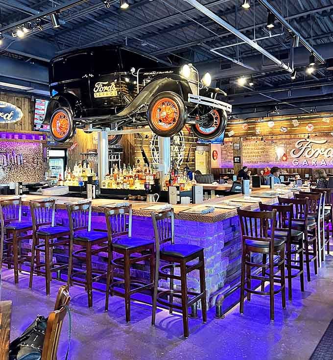 The bar area features a suspended vintage car because regular ceiling decorations are for restaurants without imagination.
