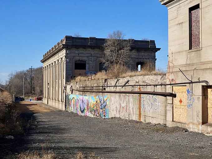 Graffiti adds unexpected color to the weathered stone, like modern footnotes on an old manuscript.