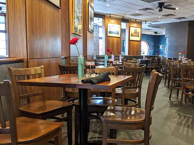 Warm wooden tables and a single red rose create a cozy atmosphere for you to enjoy a classic dinner tonight.