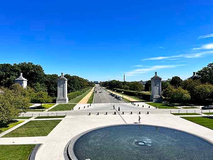 The Military Women's Memorial fountain reflects a clear sky, honoring service members who've earned every bit of recognition.