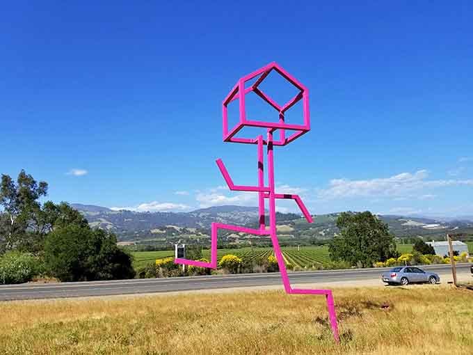 Hot pink geometry defies gravity in this playful sculpture that looks like Picasso's stick figure went three-dimensional.