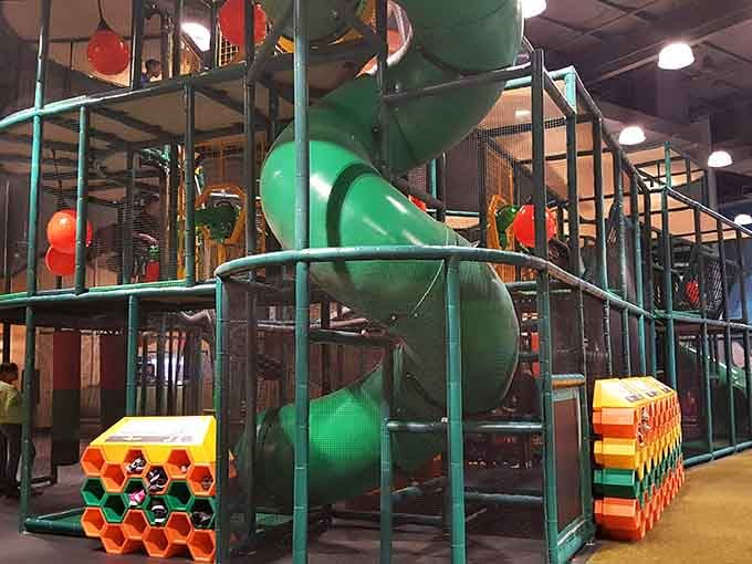 Green tunnel slides twist through the jungle gym like some architect's caffeinated dream brought to reality.