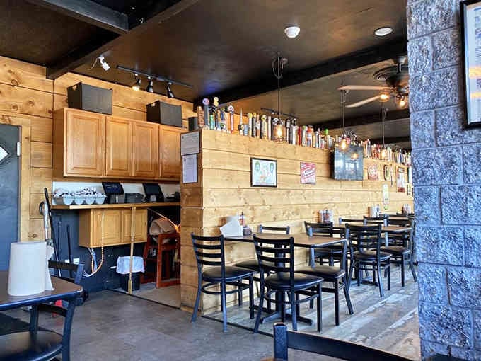 Light wood paneling and a full bar create that welcoming vibe where everyone feels at home.