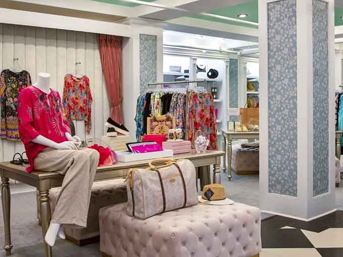 Resort wear displayed with boutique charm, where shopping becomes part of the vacation experience rather than just a transaction.