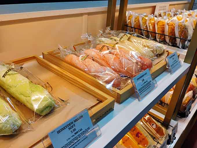 Bakery breads wrapped like precious gifts showcase the artistry of Asian pastry traditions in every fluffy layer.