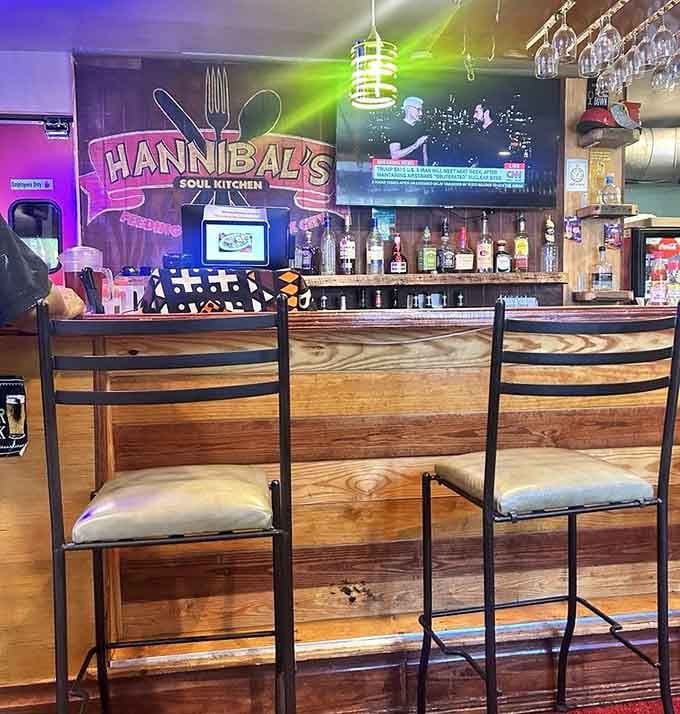 The bar area glows with welcoming light, inviting you to settle in for the long haul.