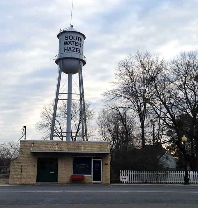 The water tower stands watch over Hazel like a proud parent, making sure everyone knows exactly where they are.