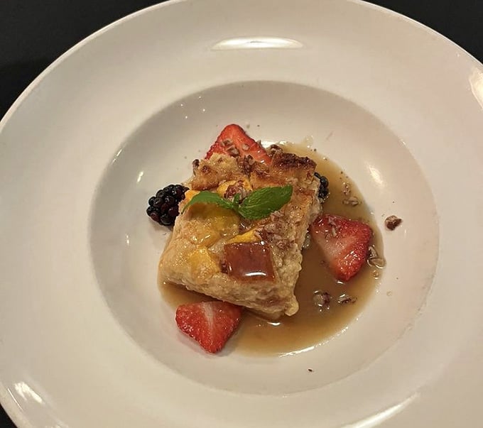 Warm bread pudding with fresh berries delivers that cozy feeling you've been craving since your last mountain adventure.