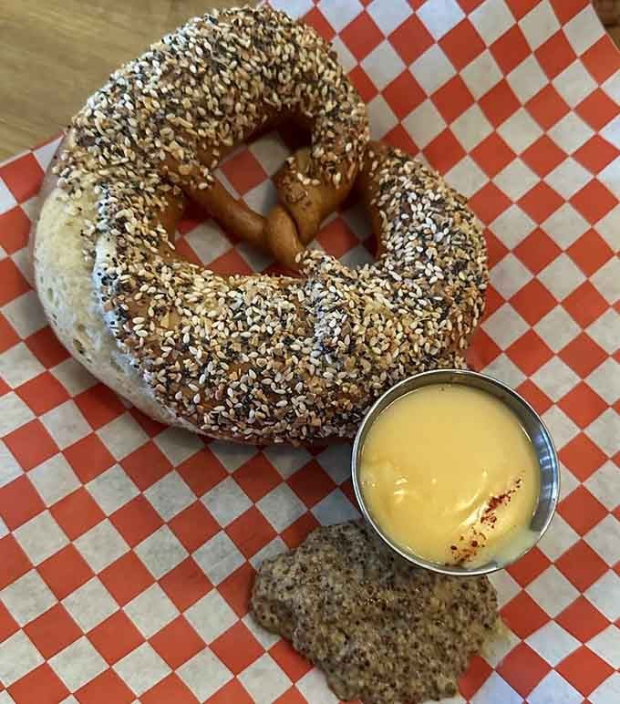 A pretzel this generously coated in everything seasoning deserves its own standing ovation, honestly.