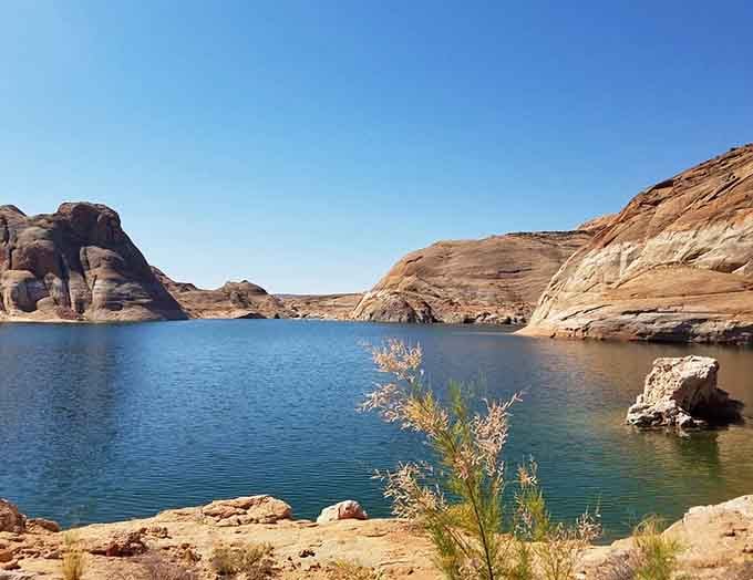 Lake Powell's tranquil coves offer peaceful moments between the excitement of canyon exploration adventures.