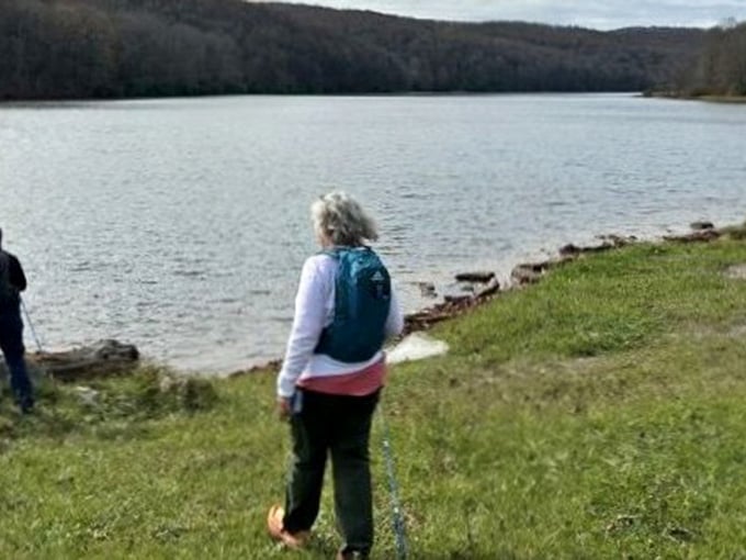 Standing at the water's edge, contemplating life's big questions or just enjoying the view, both valid.