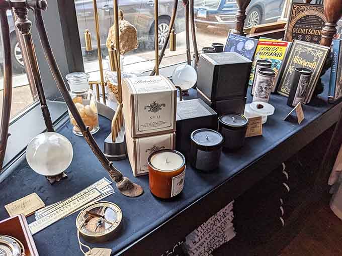 Ritual candles and crystal spheres catching the light, transforming ordinary windowsill displays into something genuinely enchanting and beautiful.