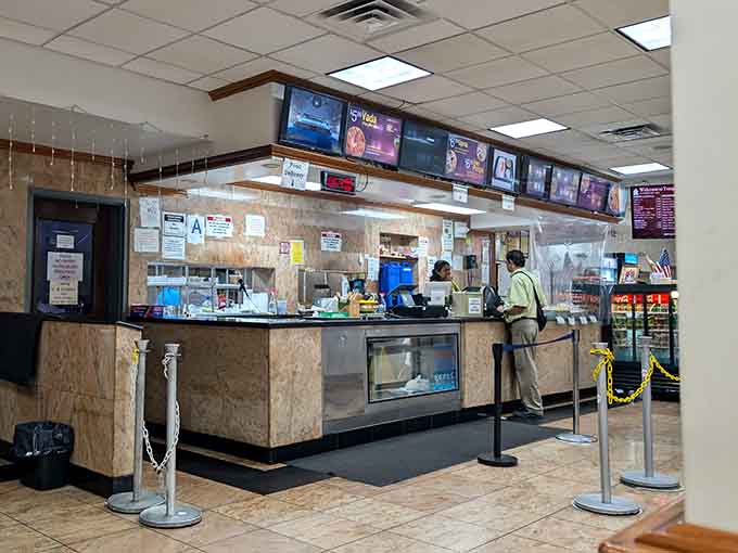 Behind this counter, skilled hands assemble orders with the efficiency of people who've perfected their craft through countless repetitions daily.