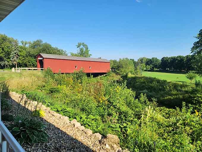 Surrounded by lush greenery, this bridge looks like Mother Nature decided to frame her favorite artwork.