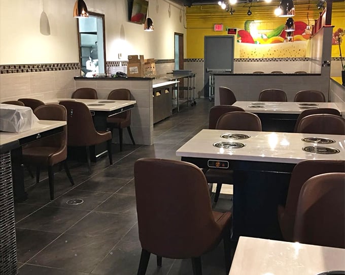 Spacious tables with built-in burners mean you're not bumping elbows while cooking your own culinary masterpiece here.