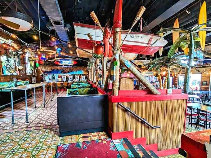 Surfboards dangling from the ceiling and tiki decor everywhere create an atmosphere that's pure vacation mode activated.