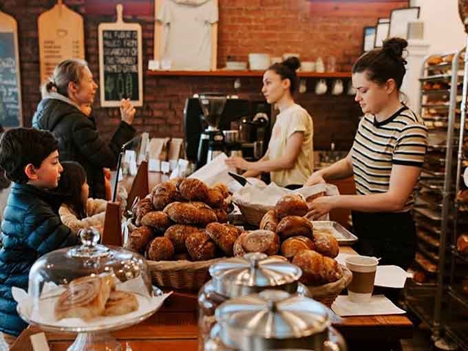 Fresh pastries piled high while friendly staff help customers is the kind of scene that makes mornings worth waking up for.