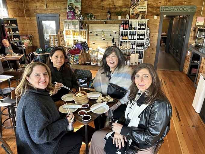 Happy diners enjoying their meals in a space that feels like your favorite aunt's kitchen, if she happened to be a culinary genius.
